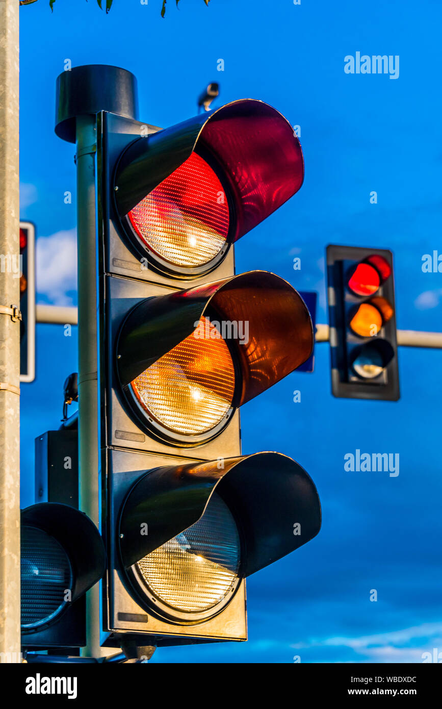Traffic lights over urban intersection. Red light Stock Photo - Alamy