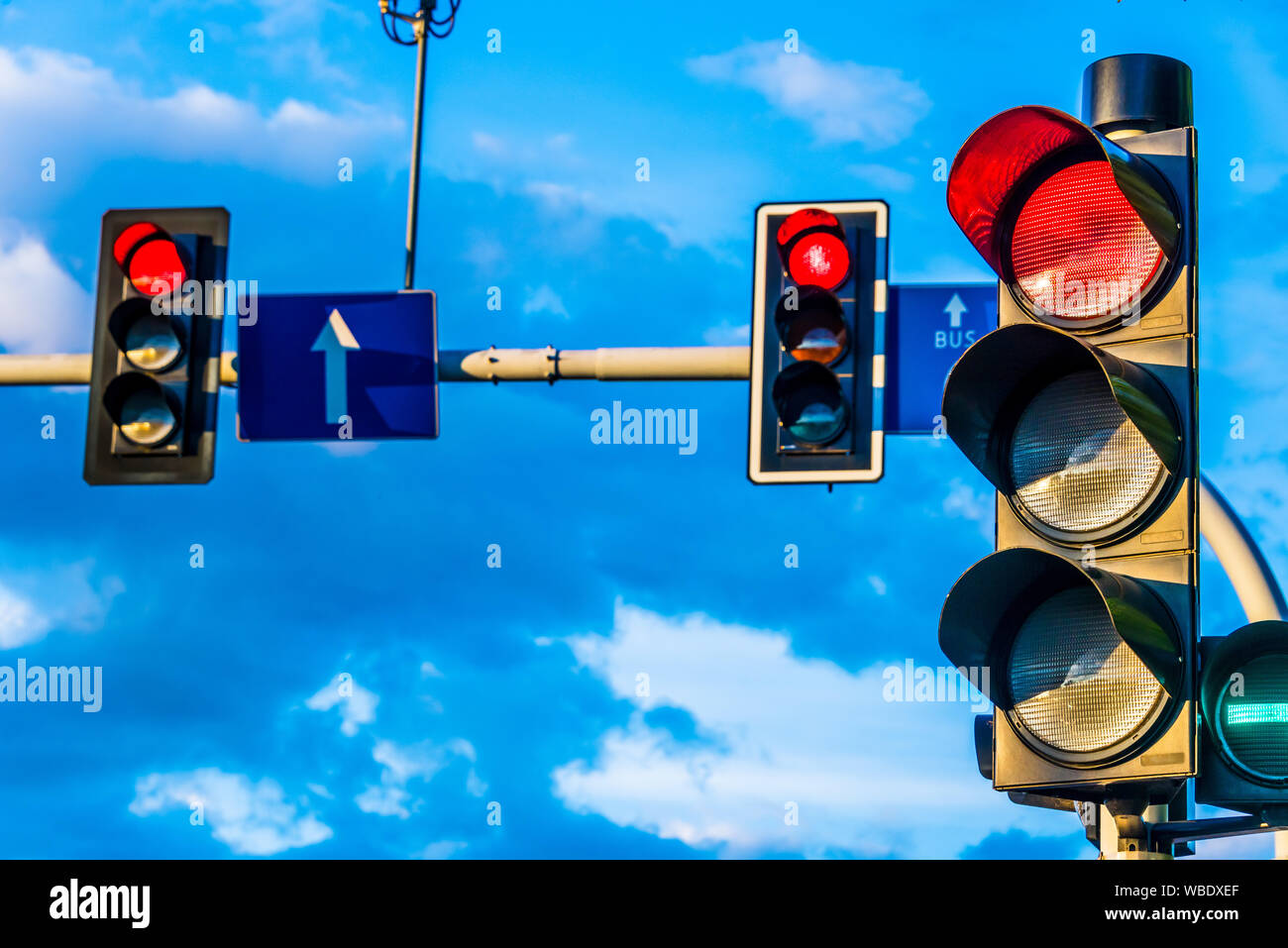 Traffic lights over urban intersection. Red light Stock Photo - Alamy