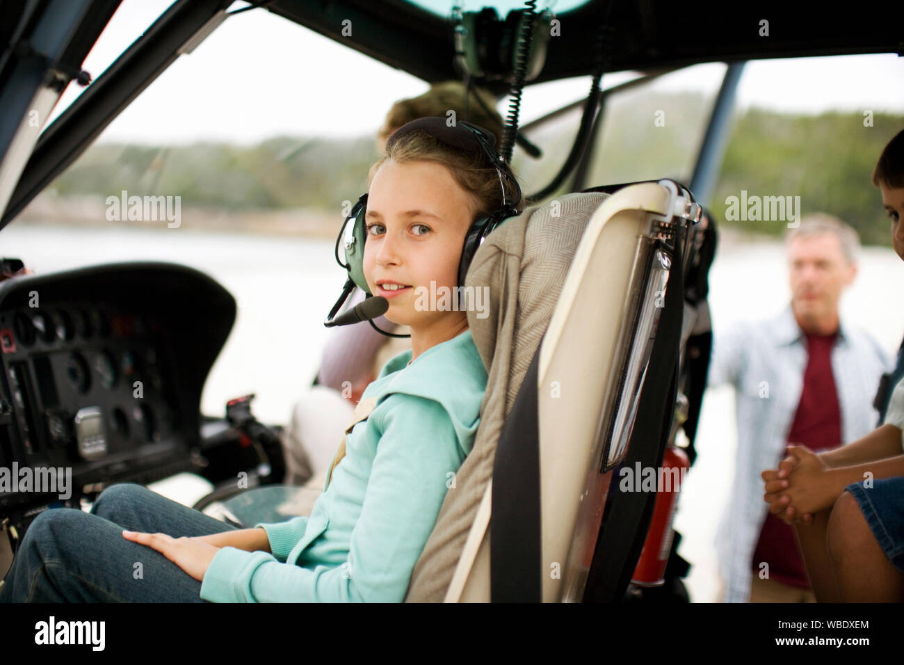 Portrait of a girl sitting in a helicopter Stock Photo - Alamy
