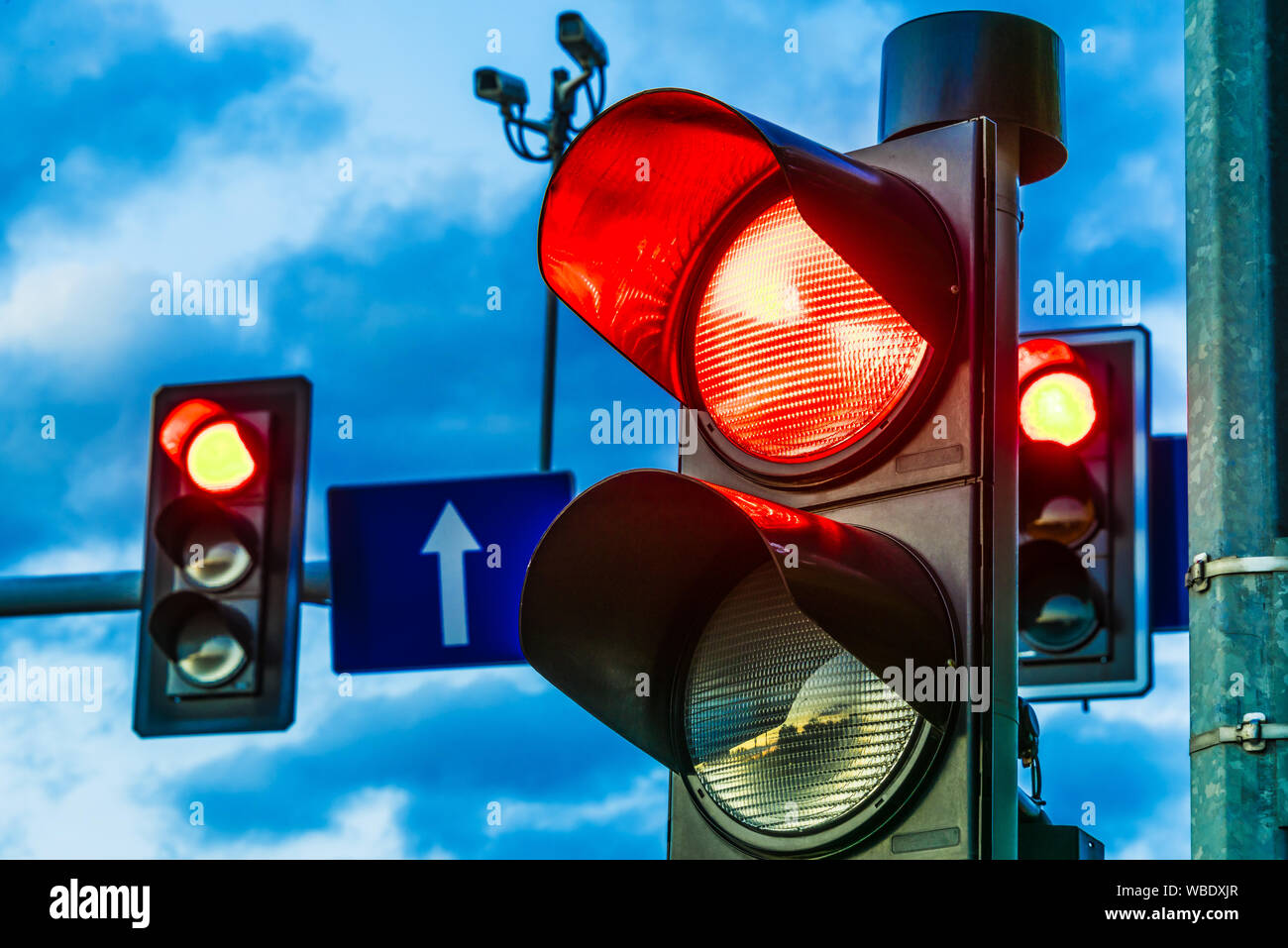 Traffic lights over urban intersection. Red light Stock Photo - Alamy
