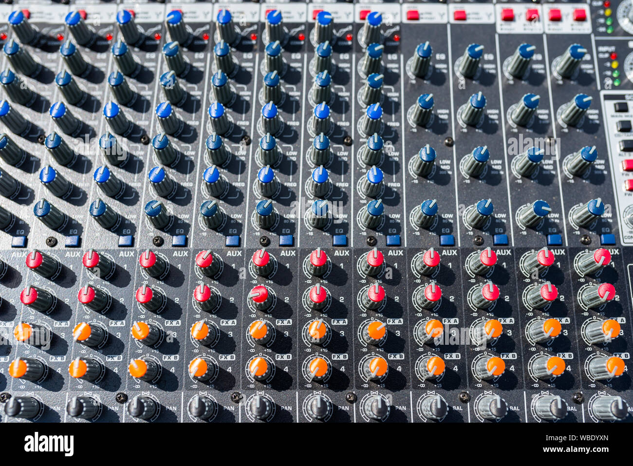 Close up photo of a professional sound mixer with many adjustments ...