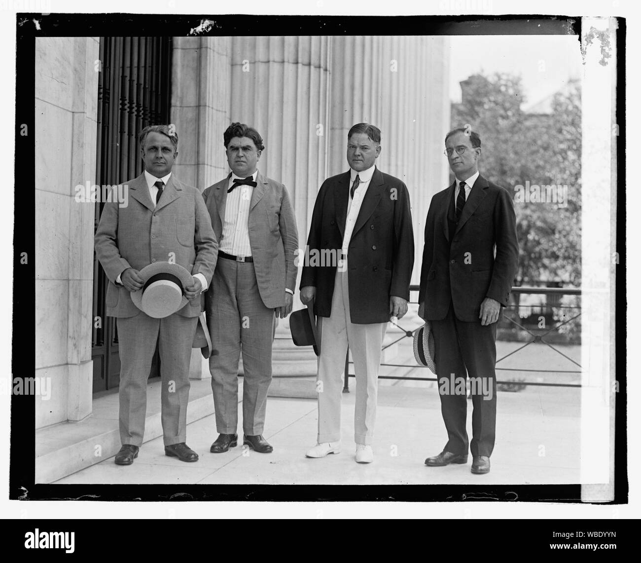 Four men standing outside building], 7/2/22 Abstract/medium: National ...