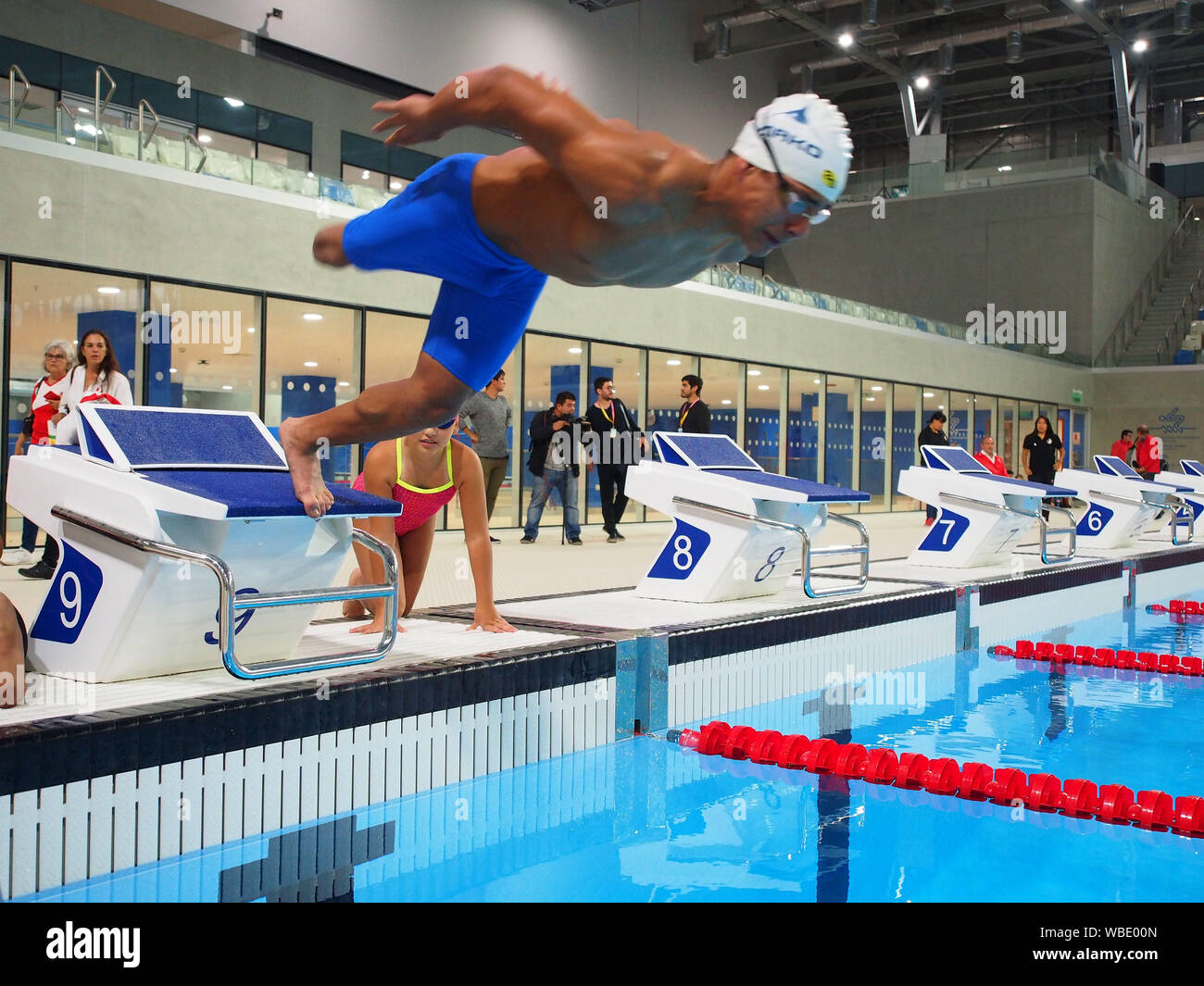 Peruvian paralympic swimmer jumping into the pool during the Aquatic ...