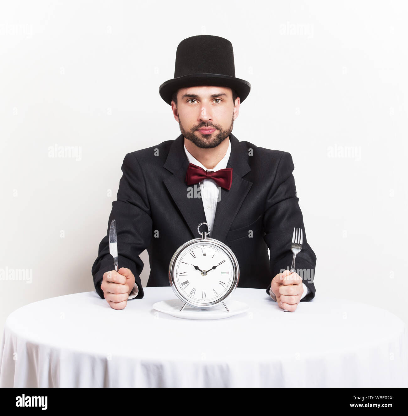 Slow restaurant service concept. Man with clock isolated on white Stock ...