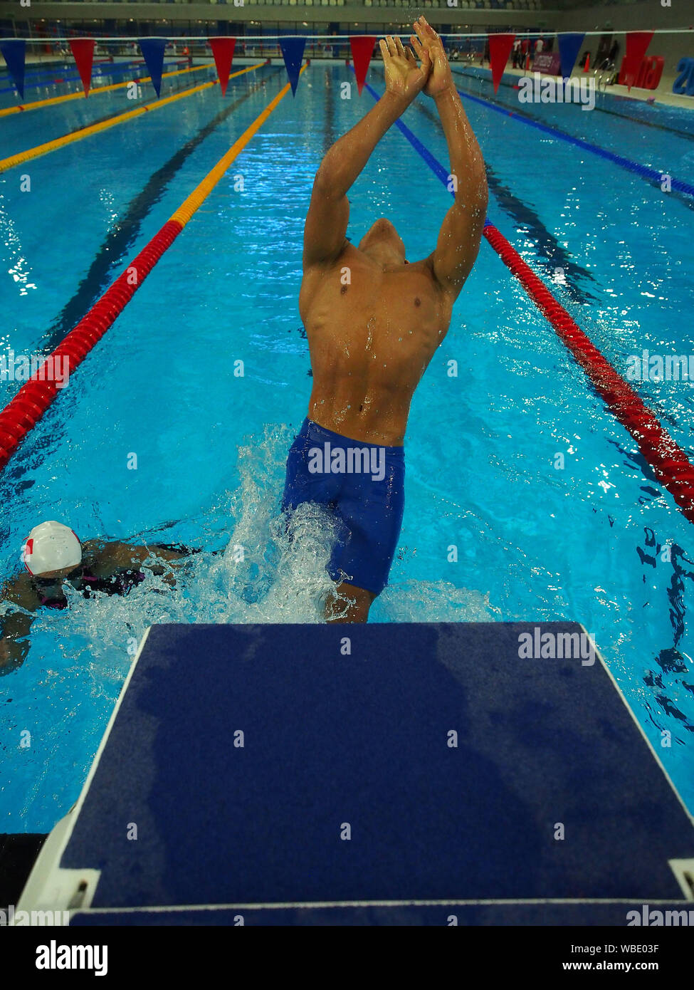 Peruvian paralympic swimmer jumping into the pool during the Aquatic ...