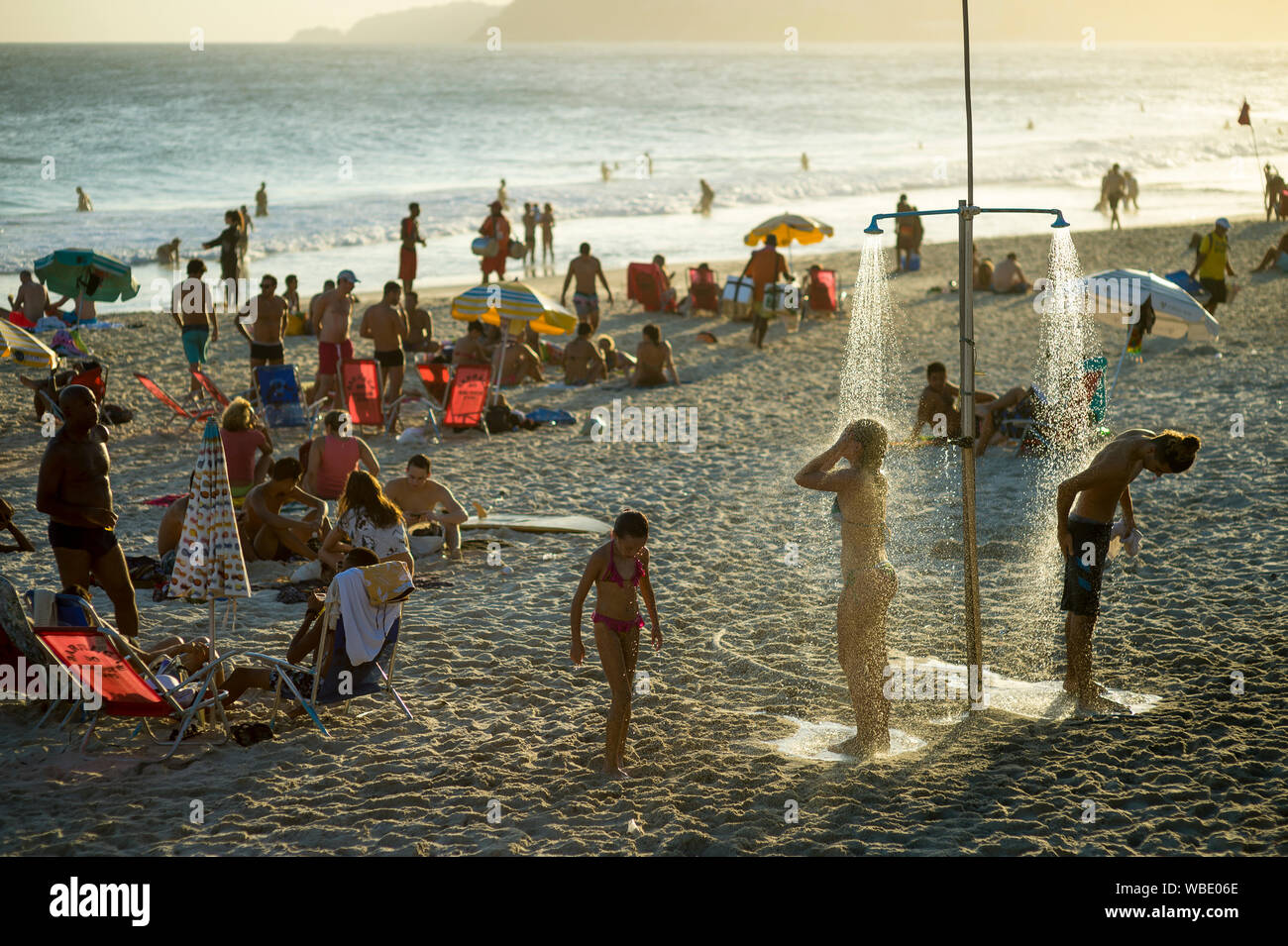 RIO DE JANEIRO - FEBRUARY 15, 2018: Beachgoers rinse off as the sun ...