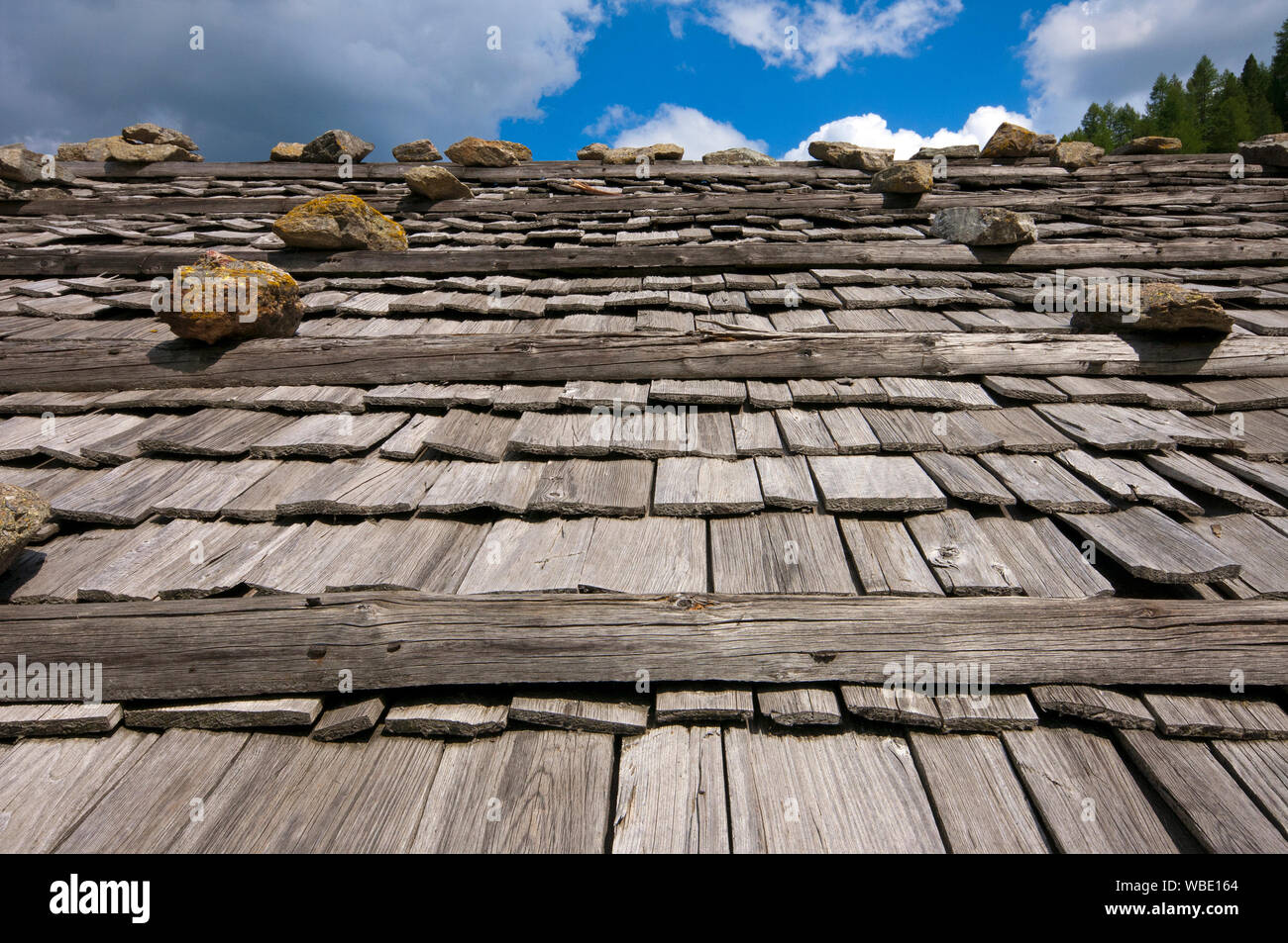 Traditional wooden roof with stones in Val d'Ultimo (Ultental), Bolzano ...