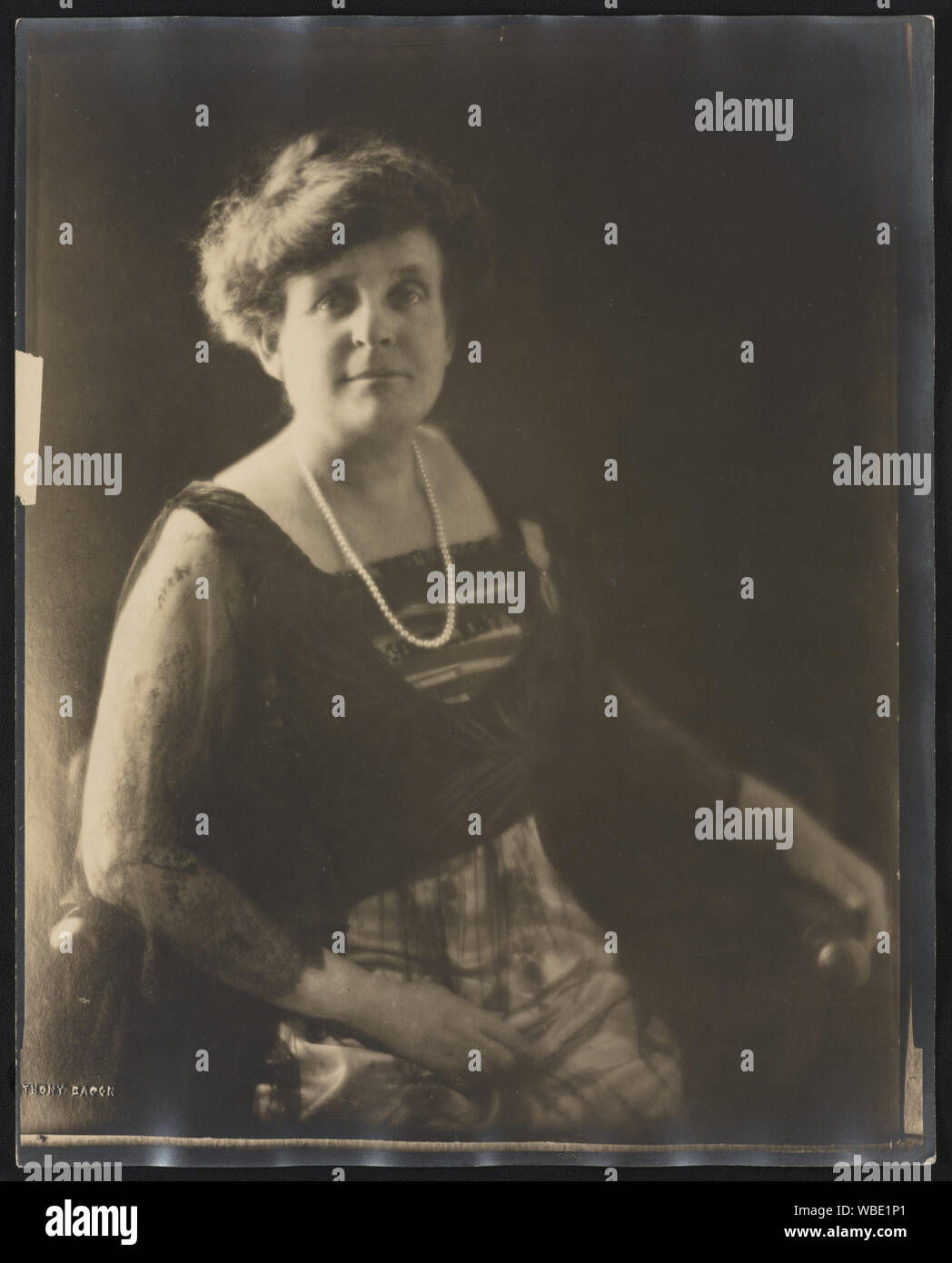 Frances Benjamin Johnston, photographer, posed wearing a pearl necklace ...