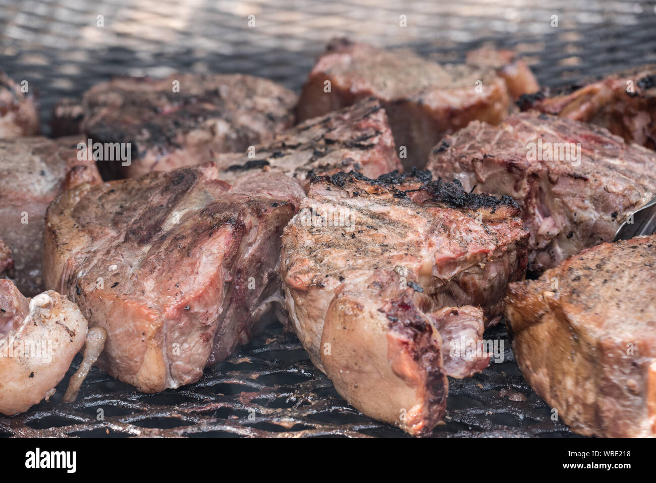 Cooking pork loin over a fire at the Minam River Lodge in Oregon's ...