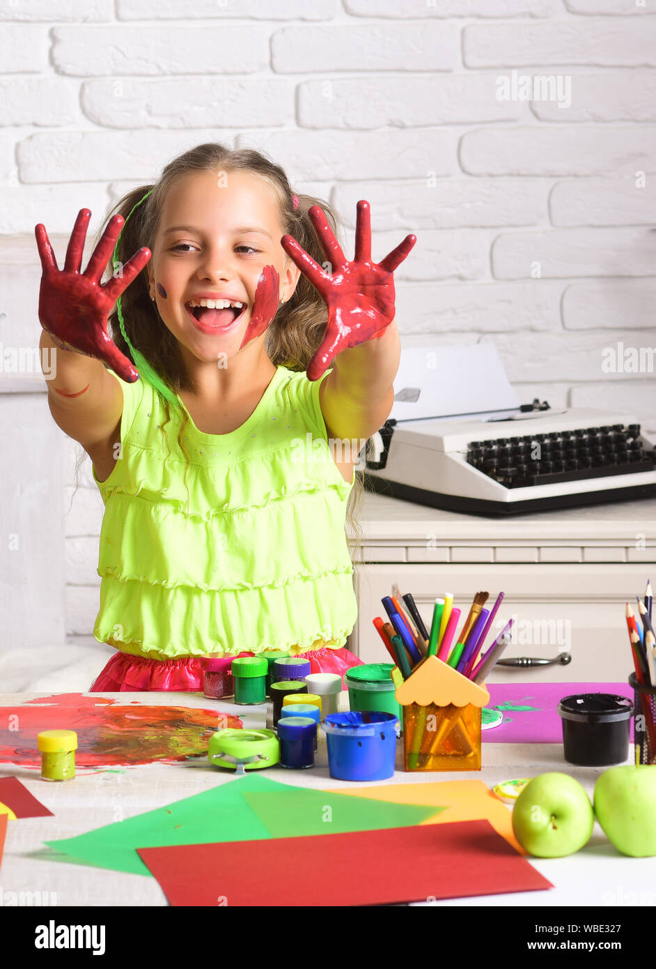 Child happy smiling with colored hands Stock Photo - Alamy