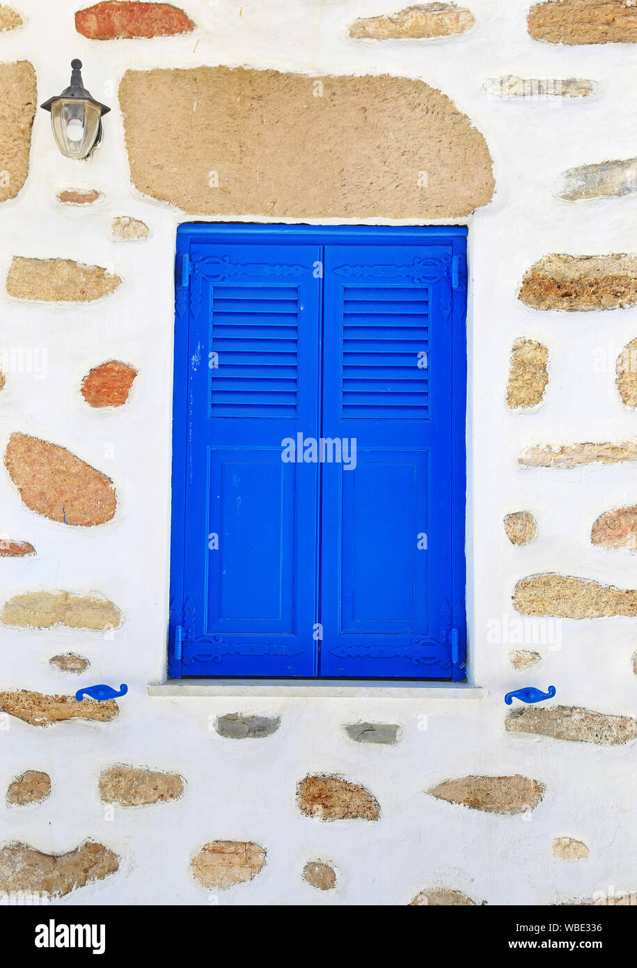 traditional blue window and stone wall at Ano Koufonisi island Cyclades ...