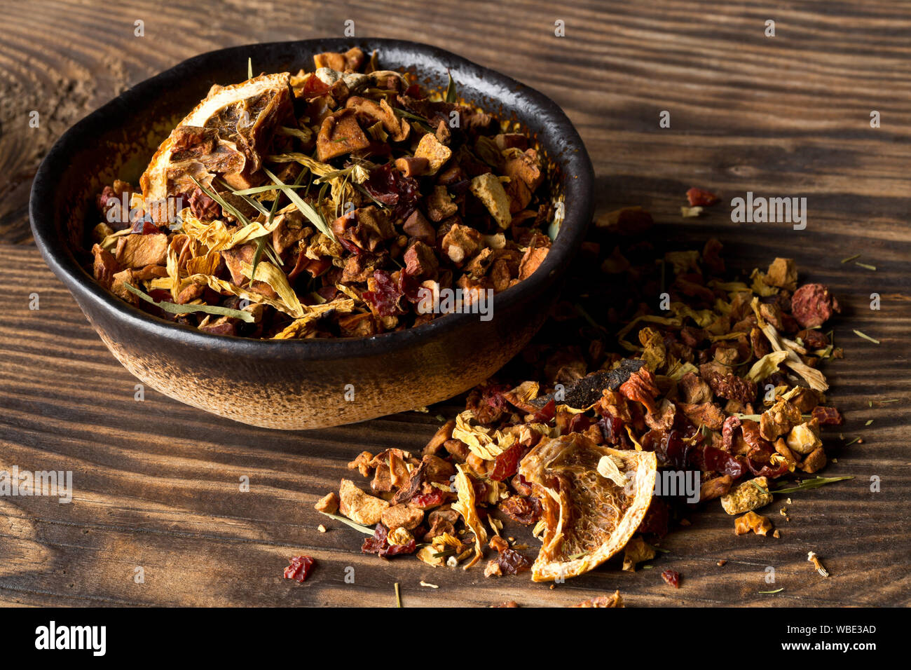 Heap of dried fruit tea infusion with oranges and strawberries mixed ...