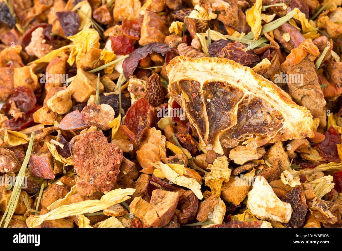 Heap of dried fruit tea infusion with oranges and strawberries mixed ...