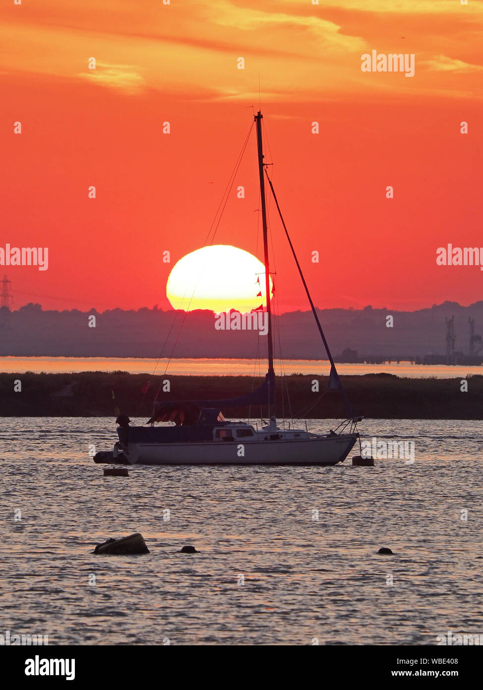 Queenborough, Kent, UK. 26th August, 2019. UK Weather: a red hot sunset ...