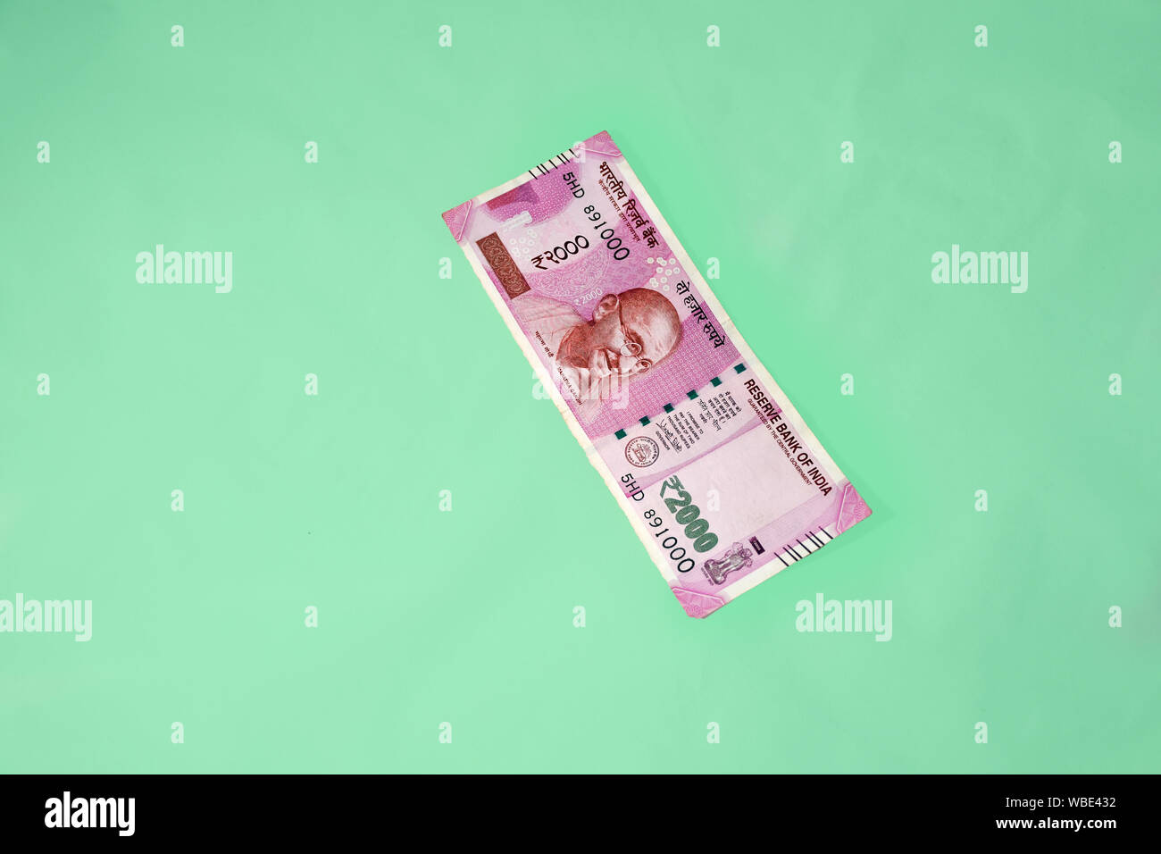 Modern Indian Two Thousand Rupees Currency Note on a minimal pink ...