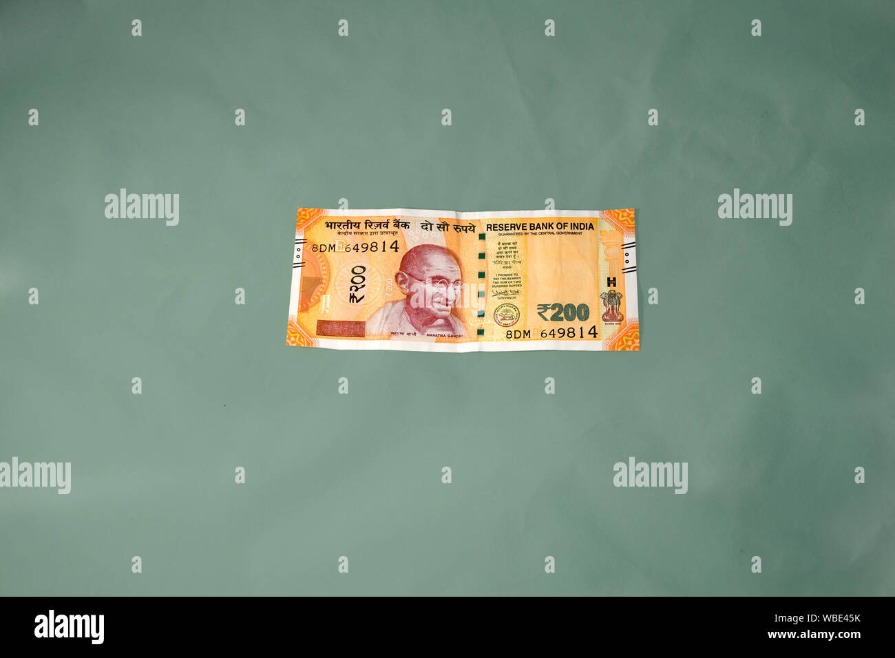 Modern Indian Two Hundred Rupees Currency Note on a minimal green ...