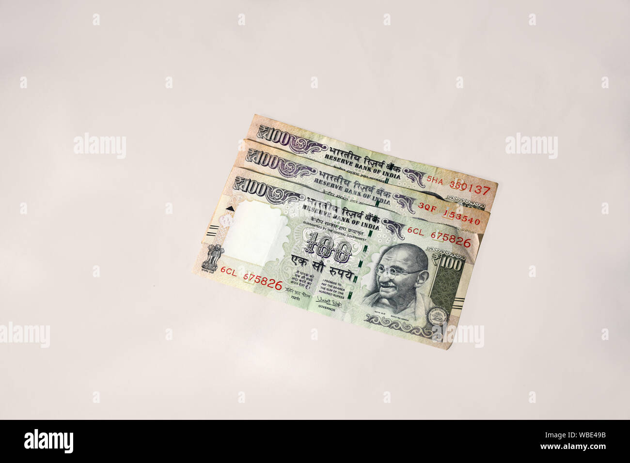 Old Indian One Hundred Rupees Currency Notes on a minimal grey ...