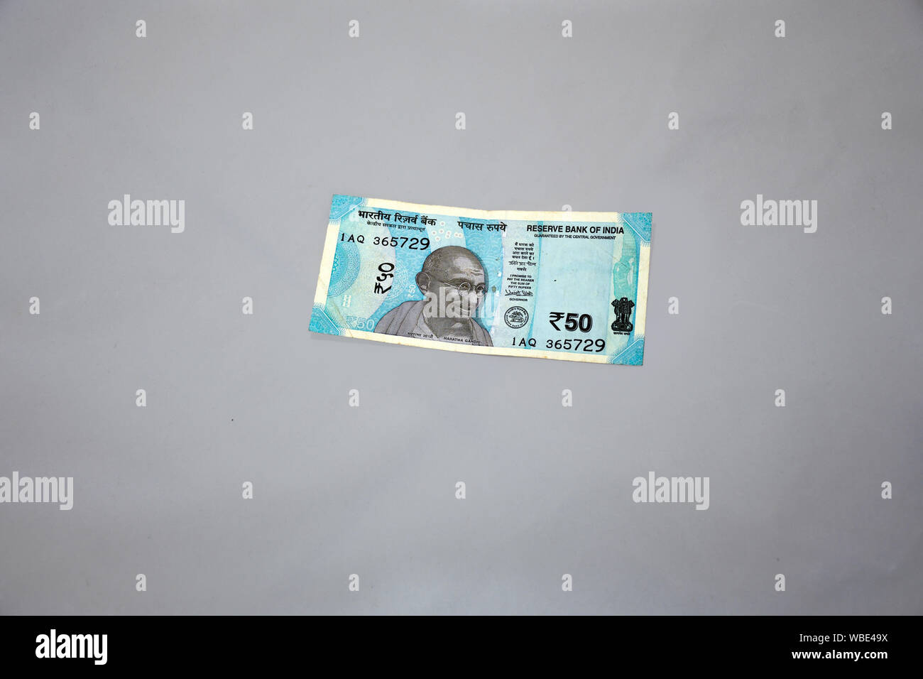Modern Indian fifty Rupees Currency Note on a minimal dark gray ...