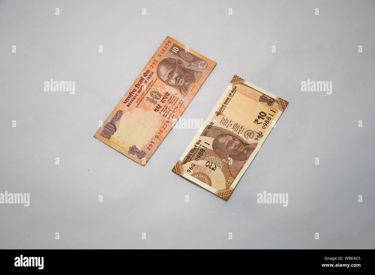 Old & Modern Indian Ten Rupee Currency Notes on a minimal gray ...