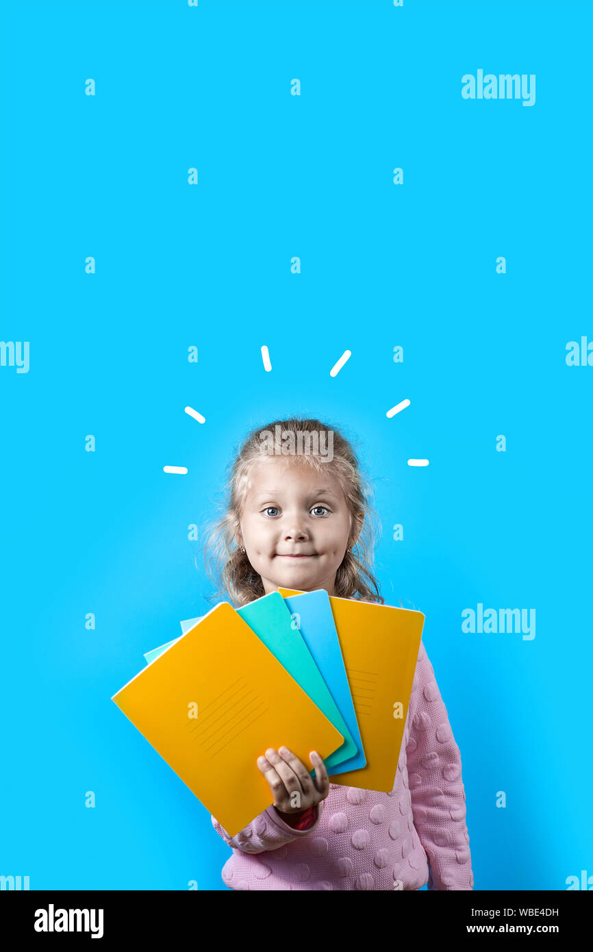 Cute cheerful girl with dimples on her cheeks and curly hair holding ...