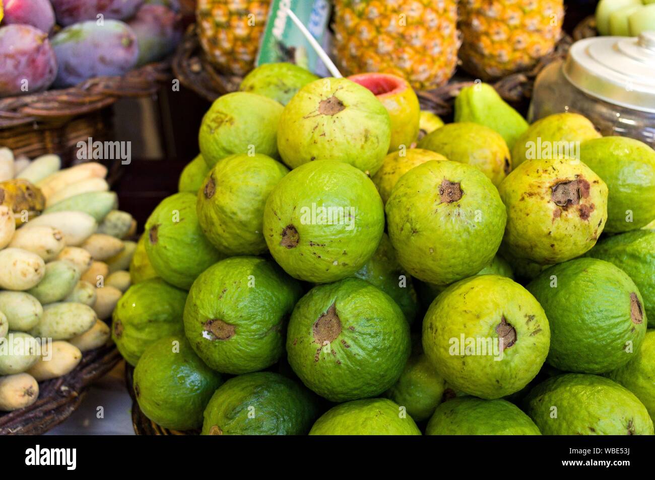Green citrus fruits in a fruit and vegetable market (Funchal, Madeira ...
