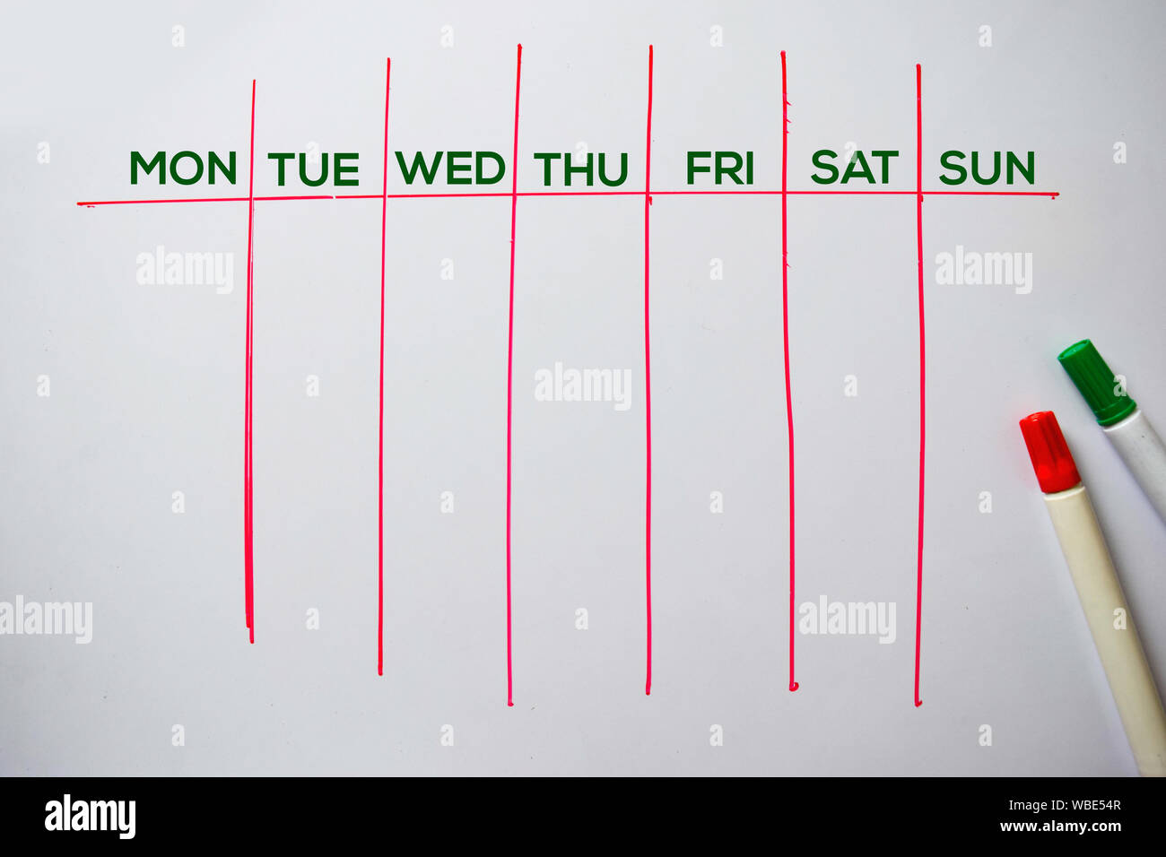 Weekly Calendar text isolated on white board background Stock Photo - Alamy