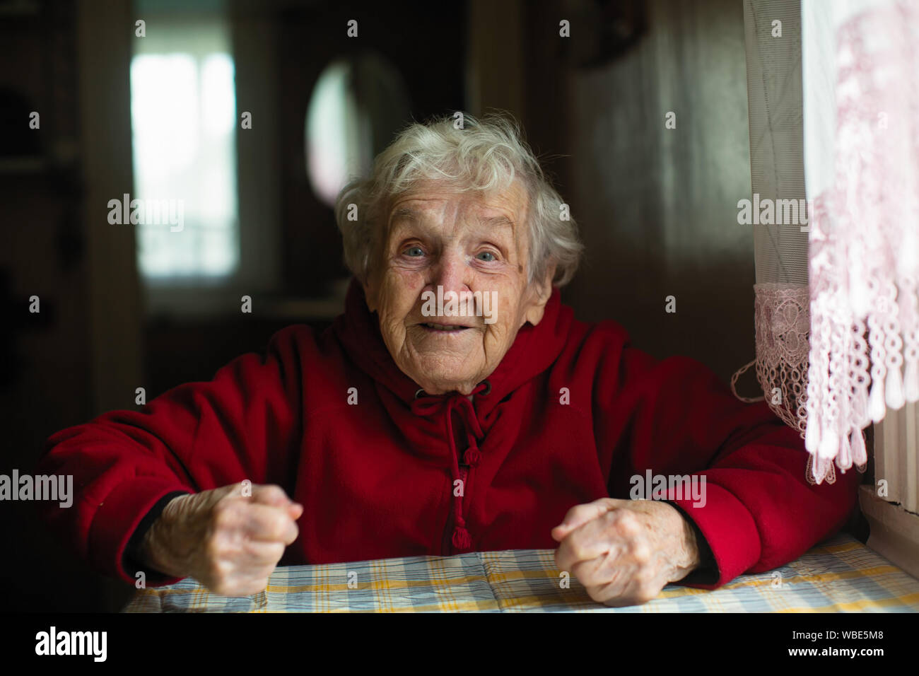 Funny senior lady looking and screaming at camera Stock Photo - Alamy