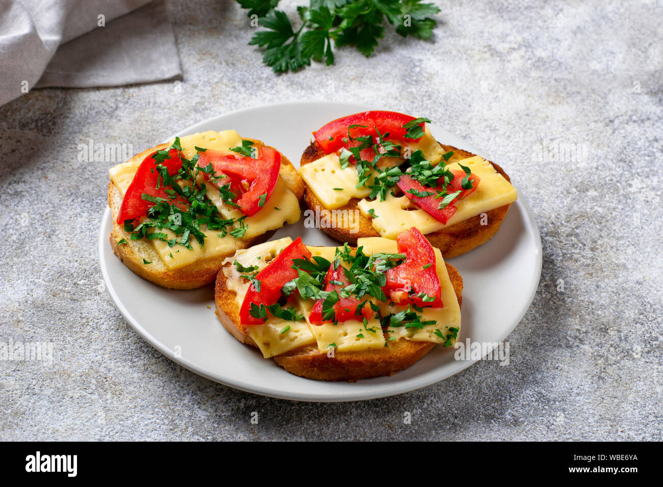 Grilled toast with tomato and cheese Stock Photo - Alamy