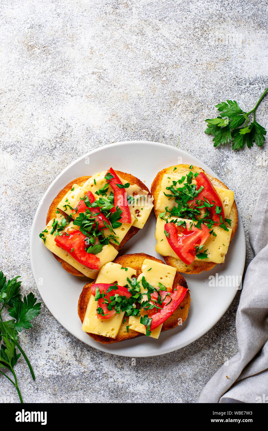 Grilled toast with tomato and cheese Stock Photo - Alamy