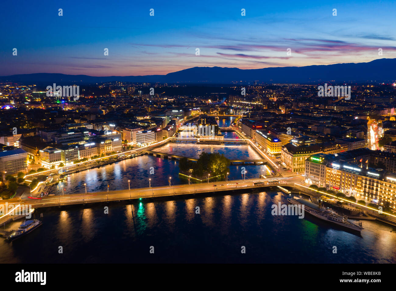 Aerial night view of Geneva city waterfront skyline in Switzerland ...