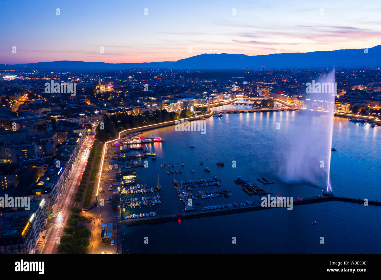 Aerial night view of Geneva city waterfront skyline in Switzerland ...