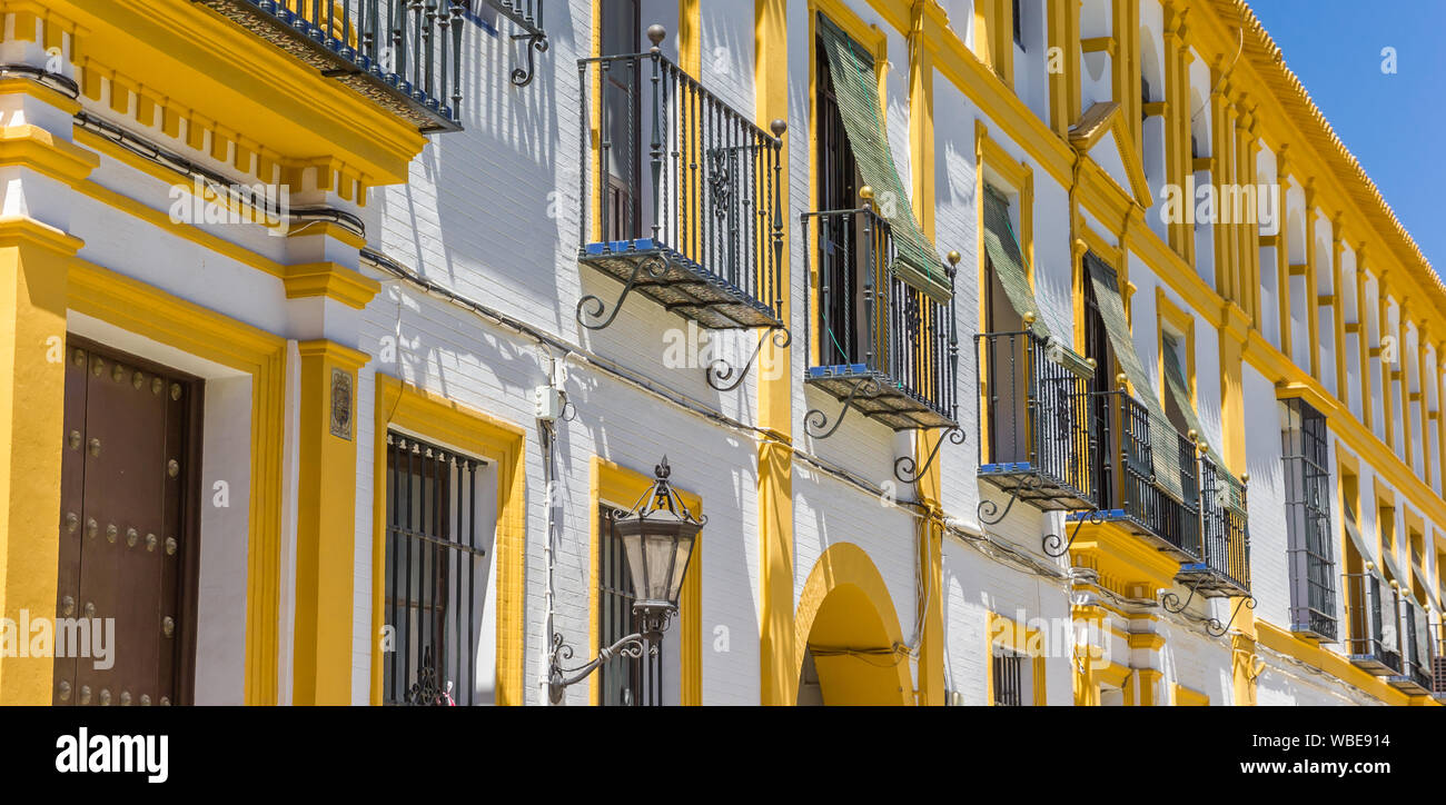 Panorama of balconies at a colorful apartment building in Sevilla ...