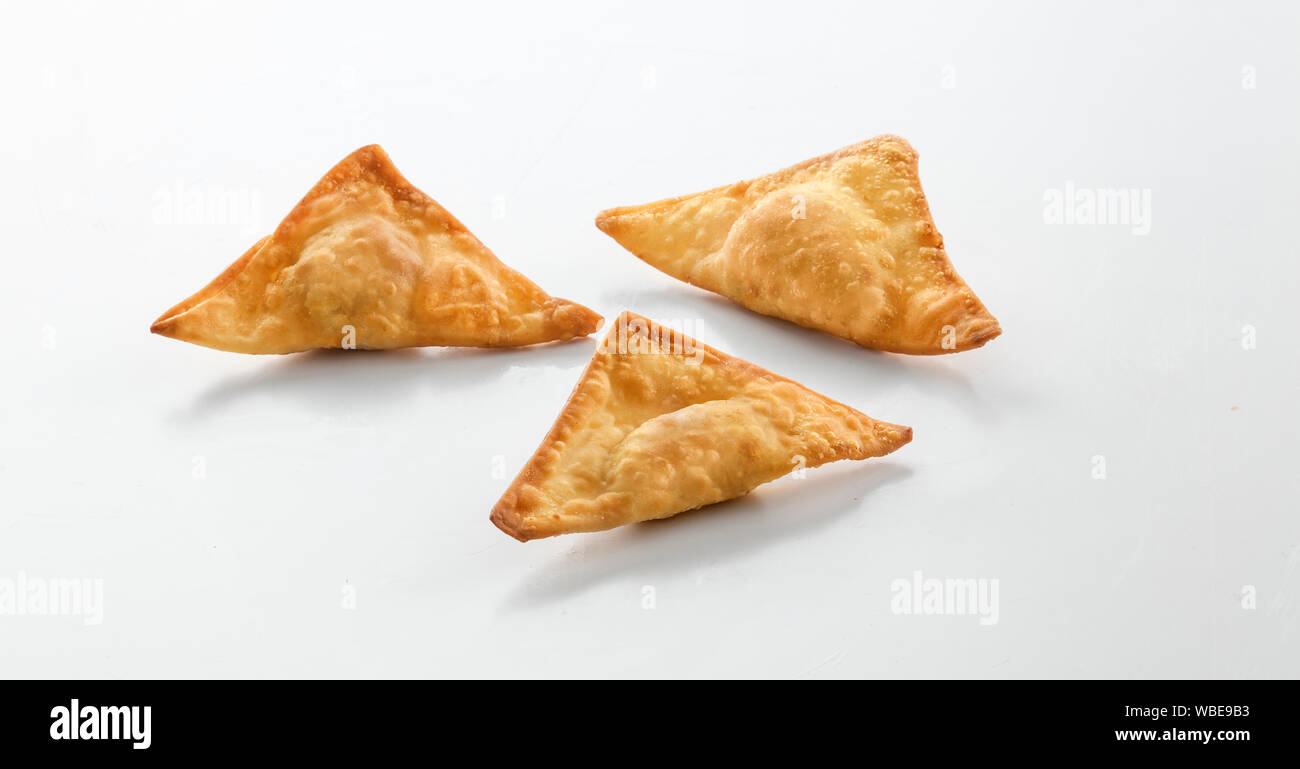 Three Wan Tan isolated on white background Stock Photo - Alamy