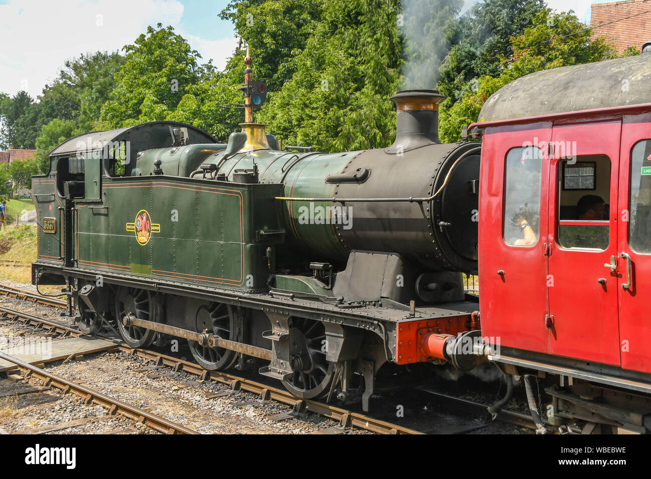 CRANMORE, ENGLAND - JULY 2019: Steam engine pulling a train departing ...