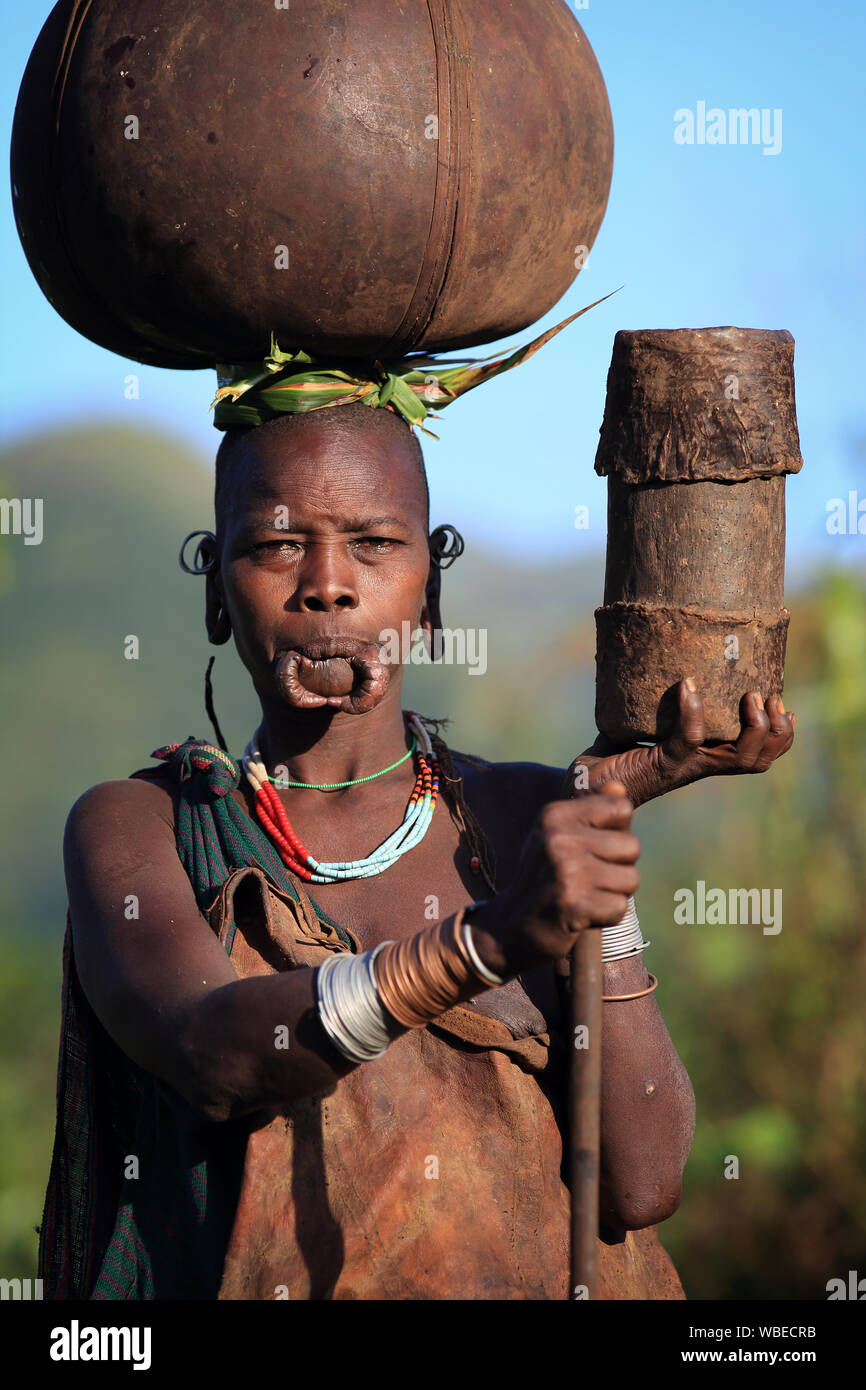 Suri woman with lipplate in South Omo, Ethiopia. A resettlement program ...
