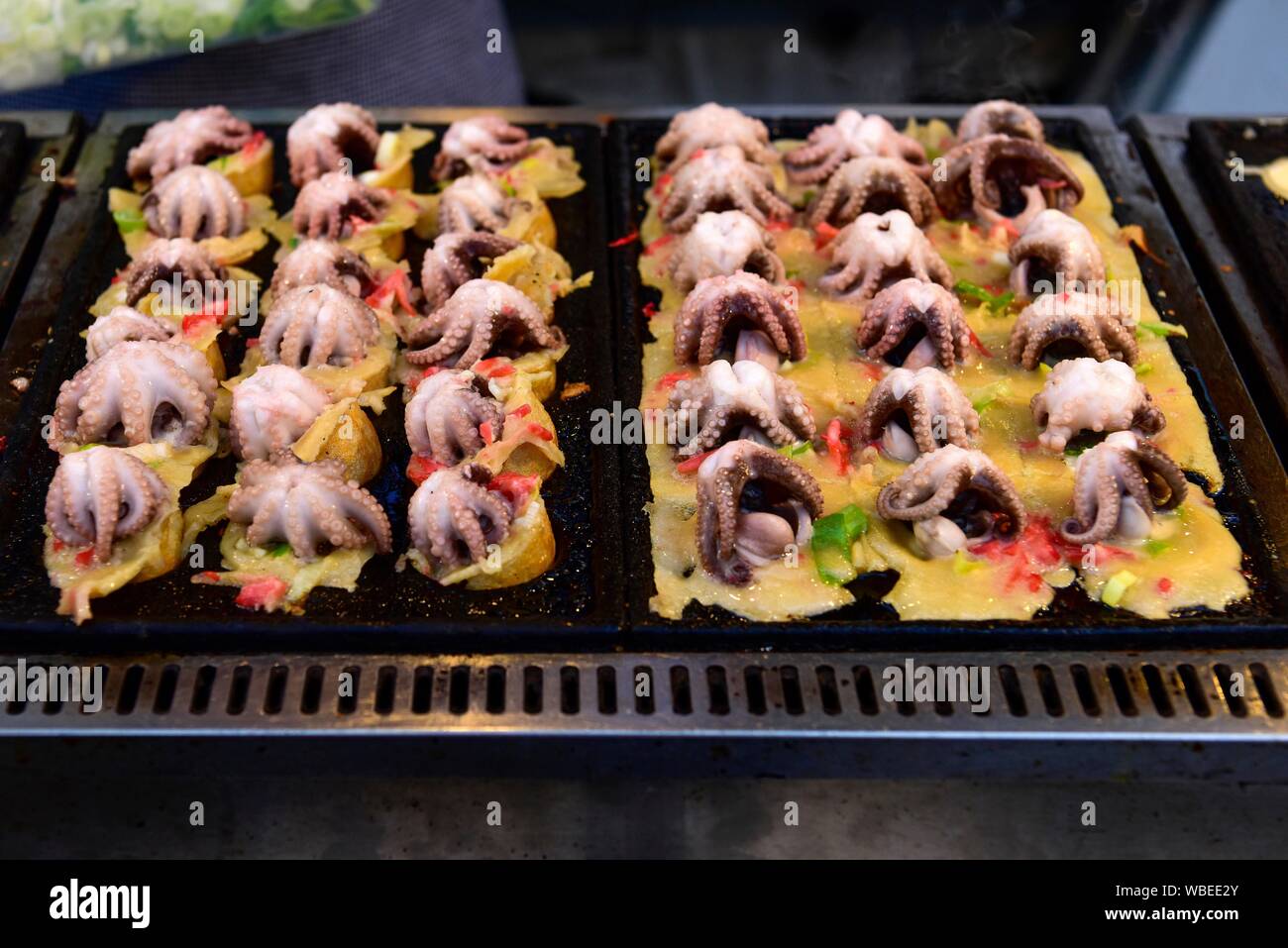 Baby octopus on grill at a food stall, Pattaya, Thailand Stock Photo ...