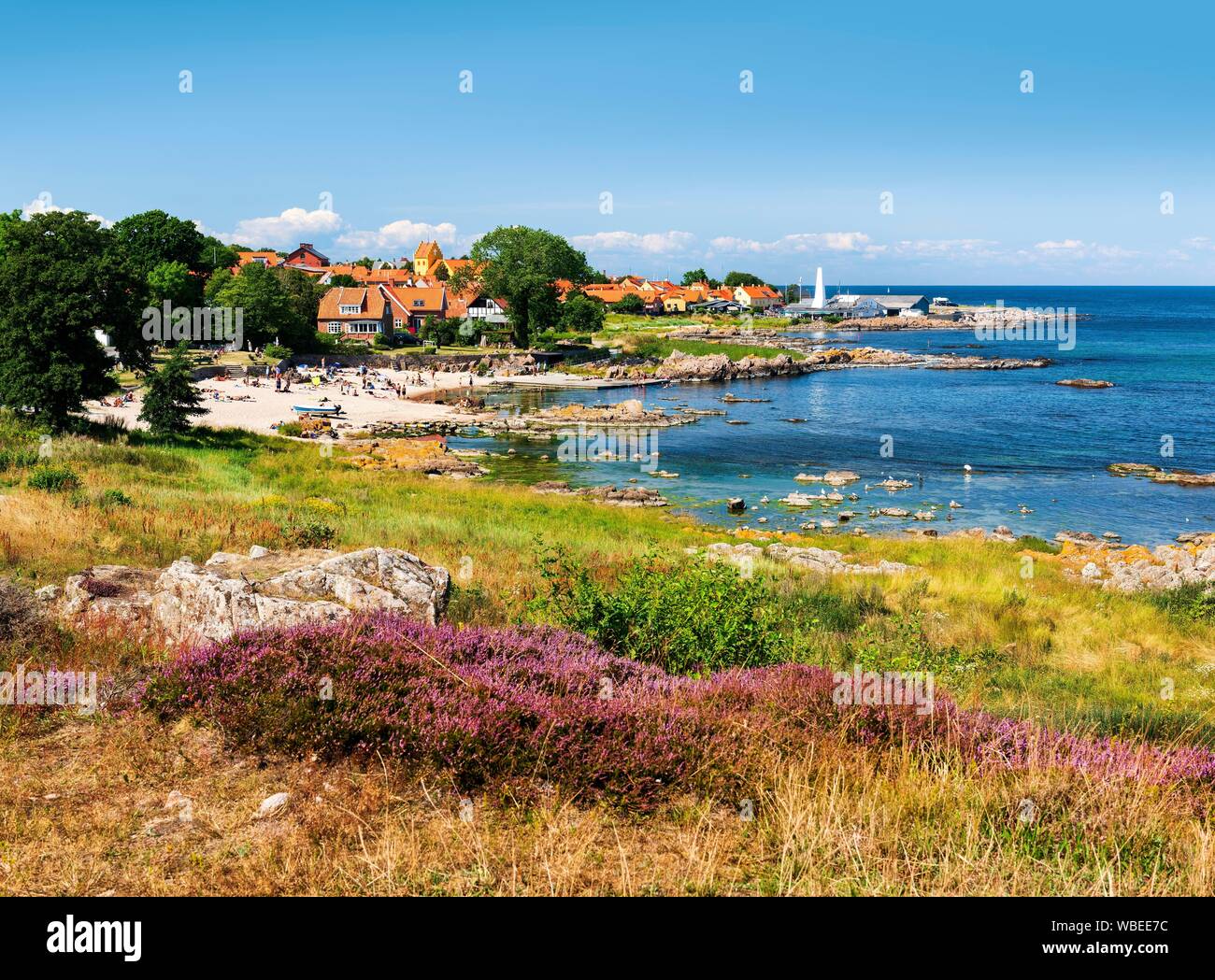 View of Allinge with bathing area and smokehouse on the rocky coast of ...