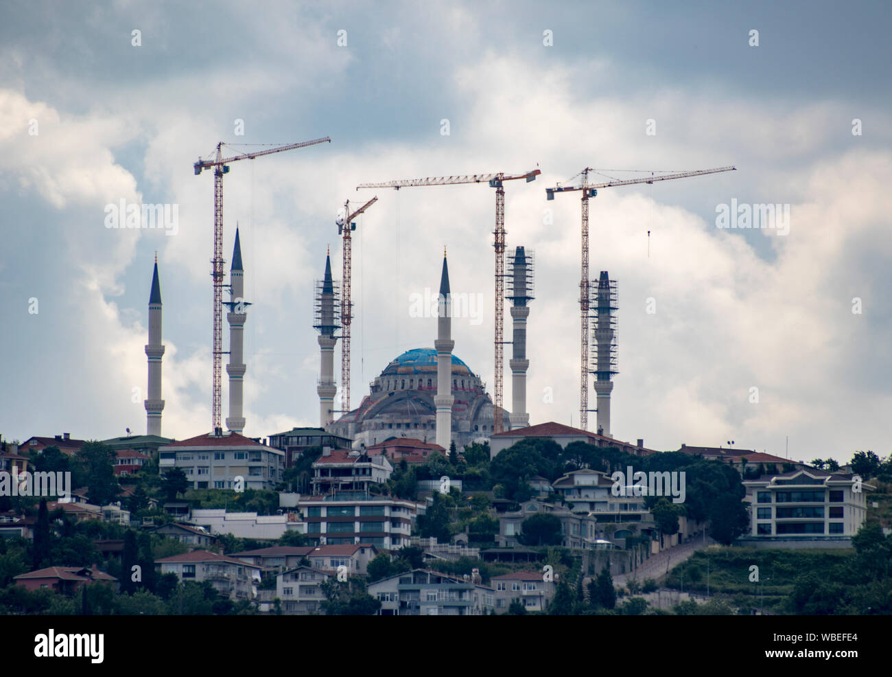 Construction cranes can be seen as mosque is being restored in Istanbul ...