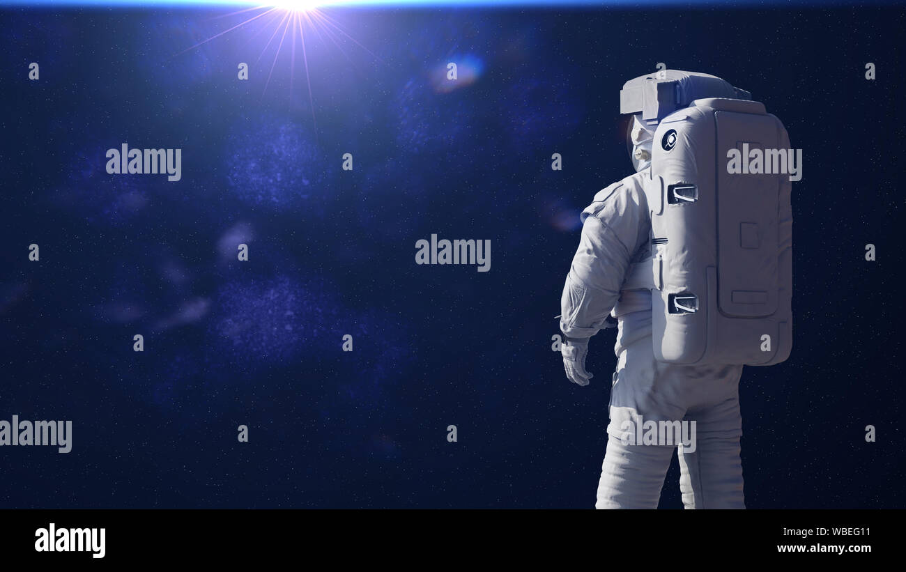 standing astronaut looking into empty space Stock Photo - Alamy