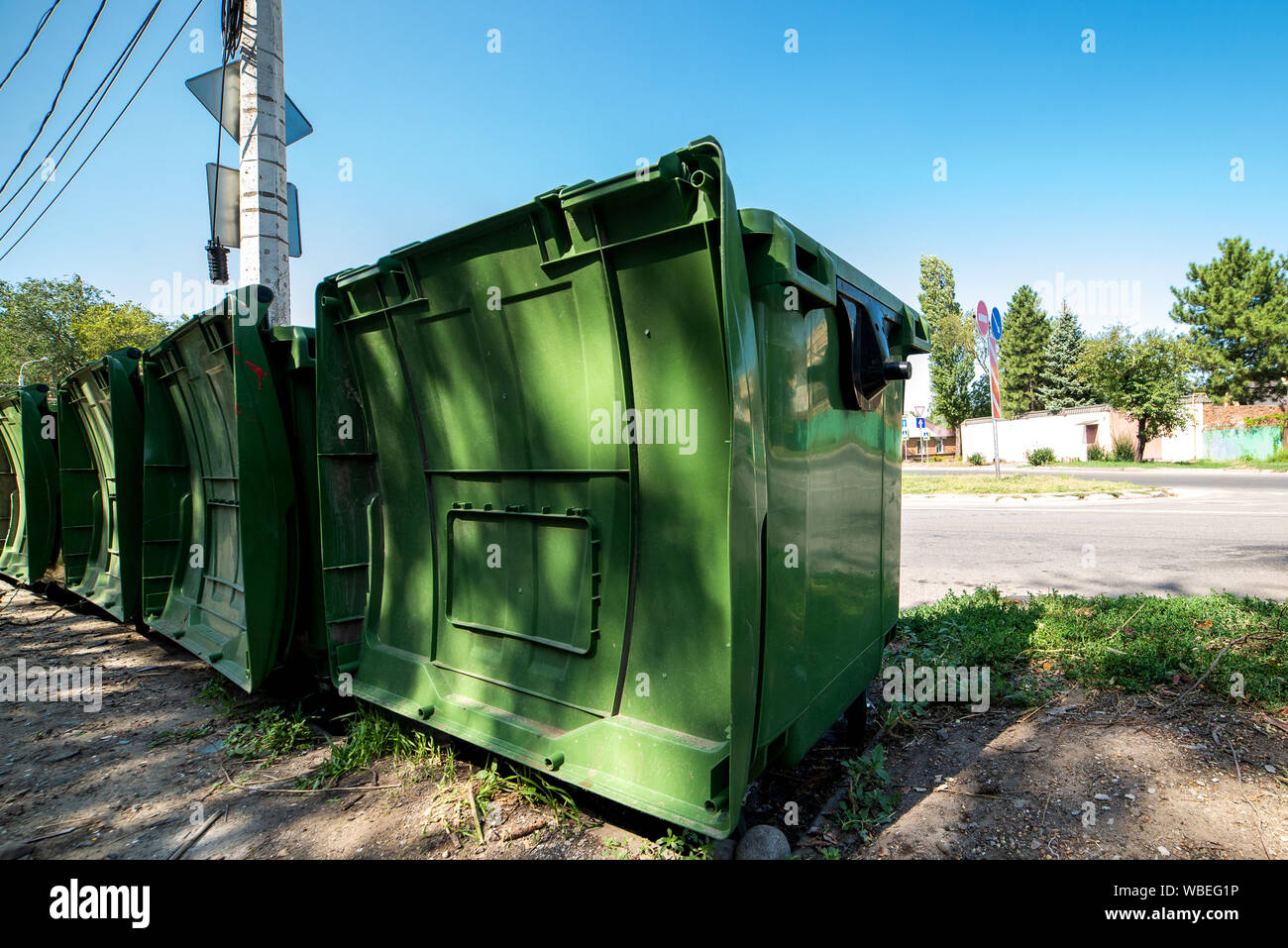 A group of Garbage cans on the side of the road Stock Photo - Alamy