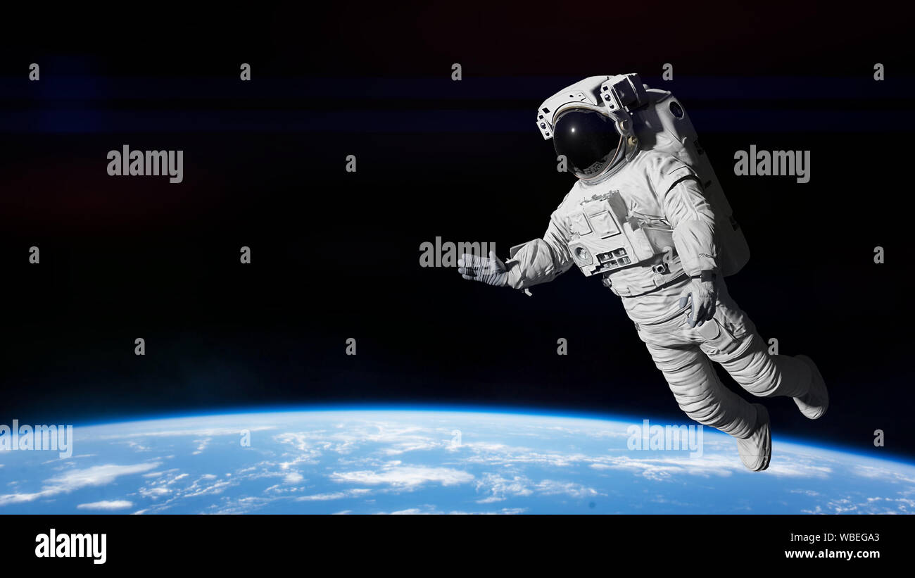 astronaut performing a spacewalk in outer space Stock Photo - Alamy