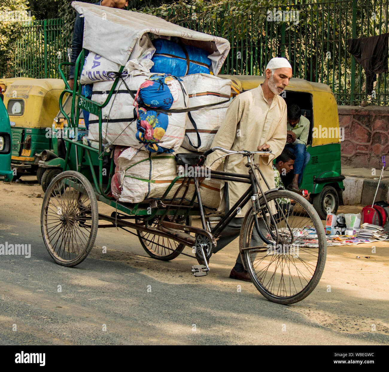 Men with heavy load on rickshaw hi-res stock photography and images - Alamy