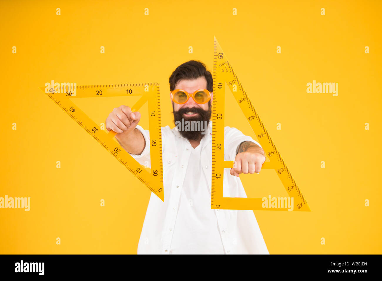 For drawing, draughting and design. Hipster holding drawing instruments ...