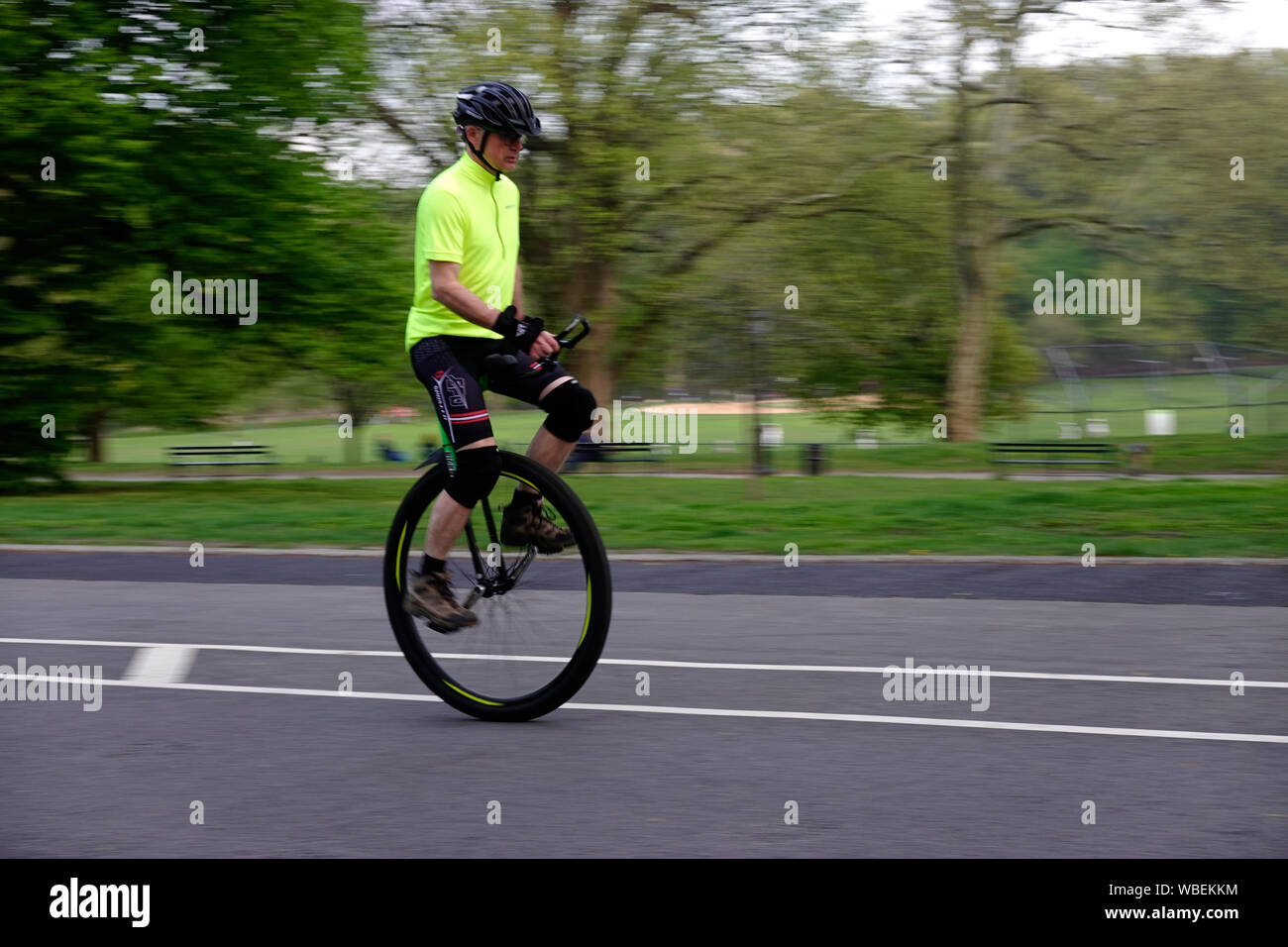 Man riding unicycle hi-res stock photography and images - Alamy