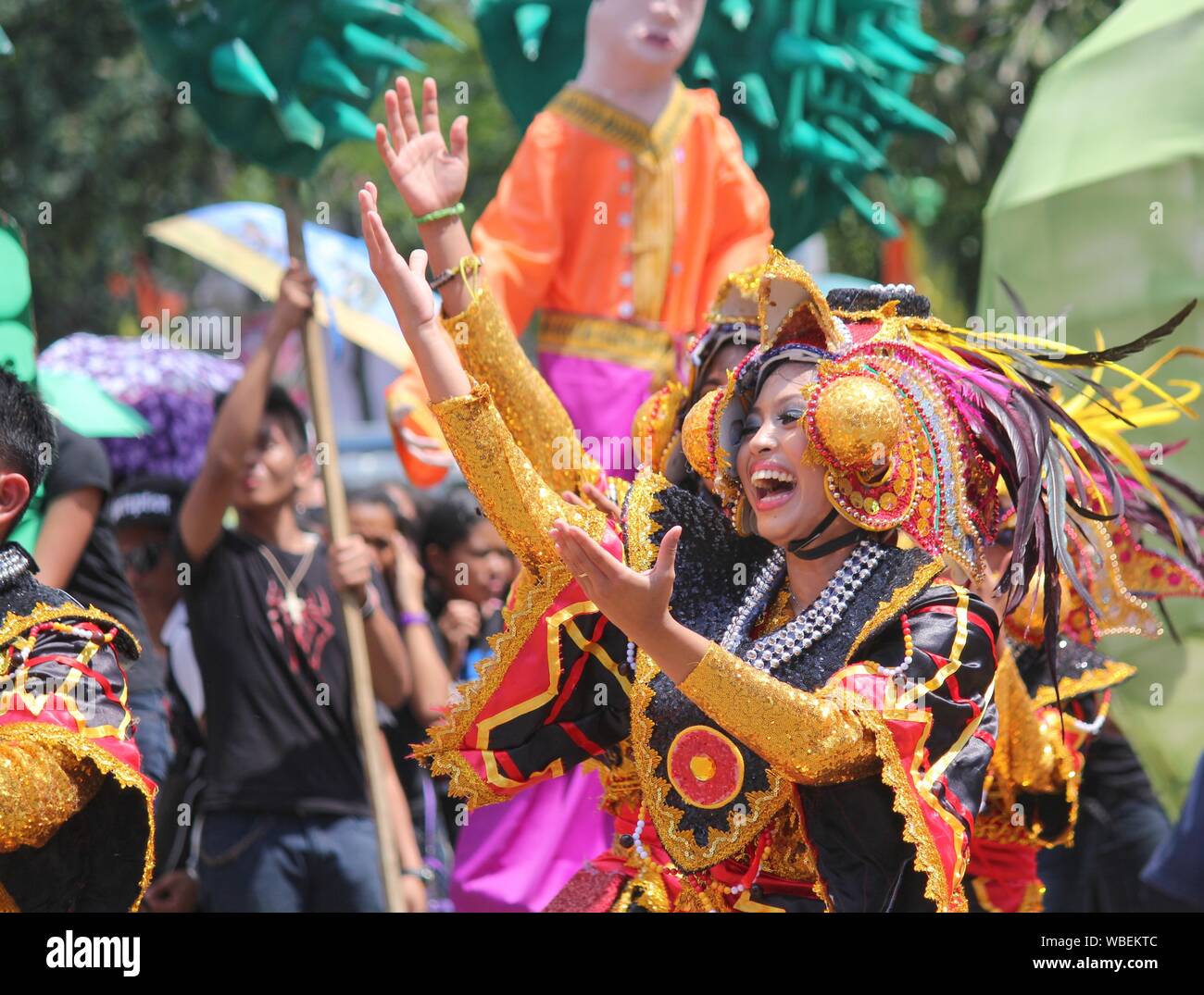 Davao City, Philippines-August 2014: Streetdancers in colorful costumes ... Davao City, Philippines-August 2014: Streetdancers in colorful costumes ...