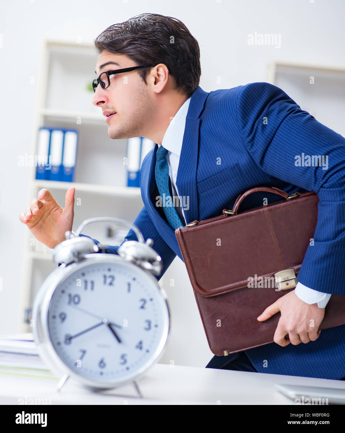 The businessman in bad time management concept Stock Photo - Alamy