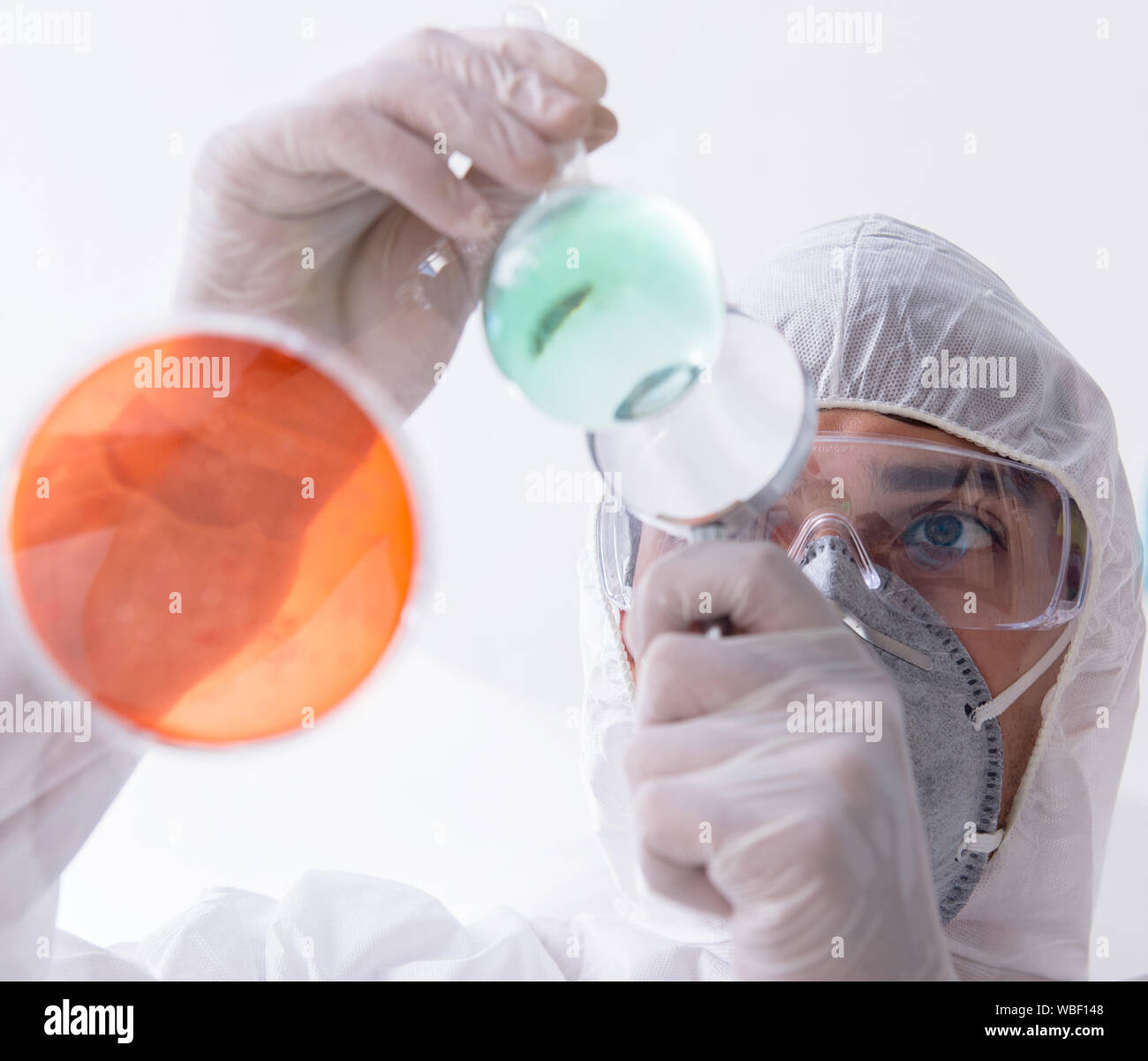 The chemist working in the laboratory with hazardous chemicals Stock ...