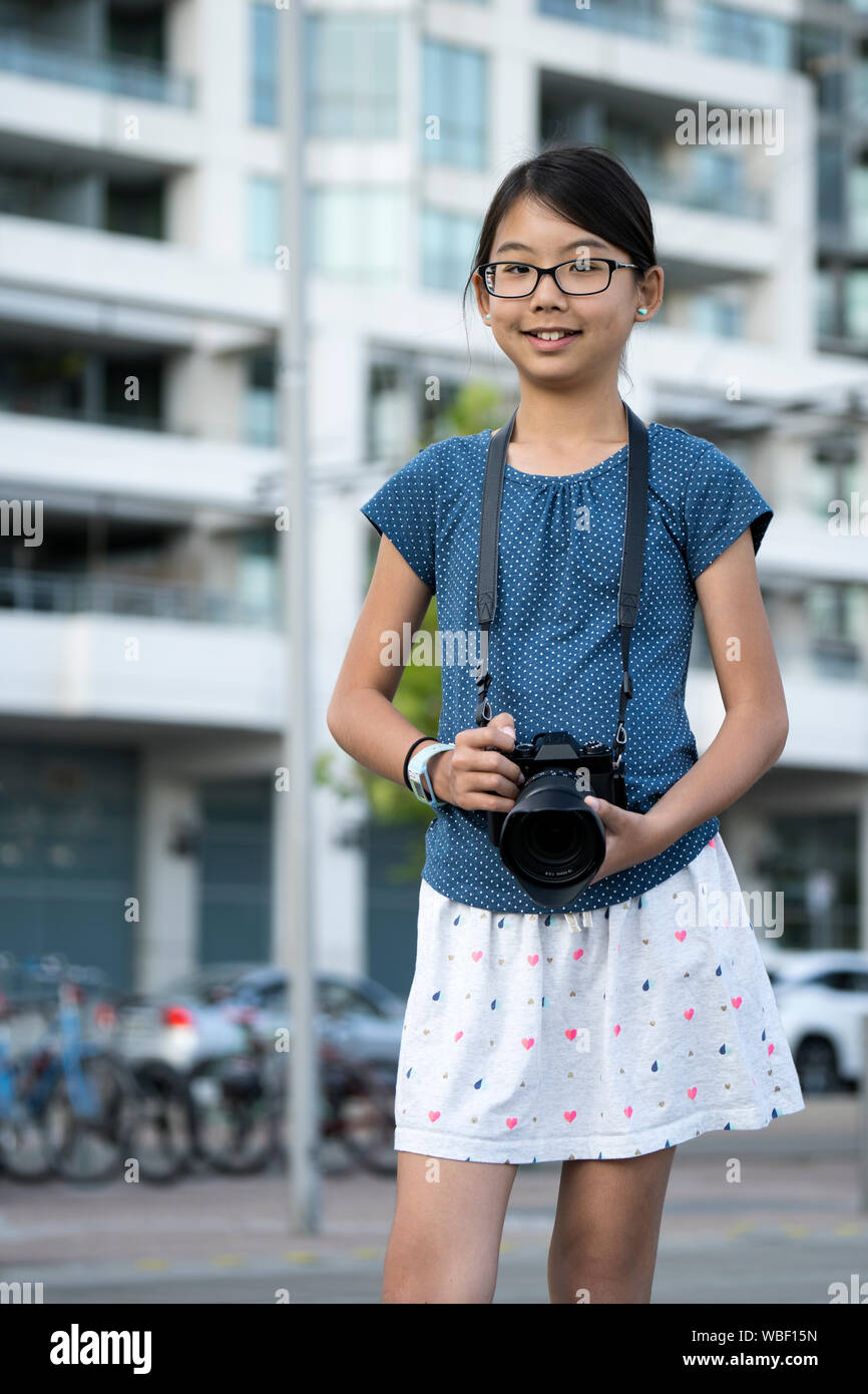 Girl photographer with digital camera Stock Photo - Alamy
