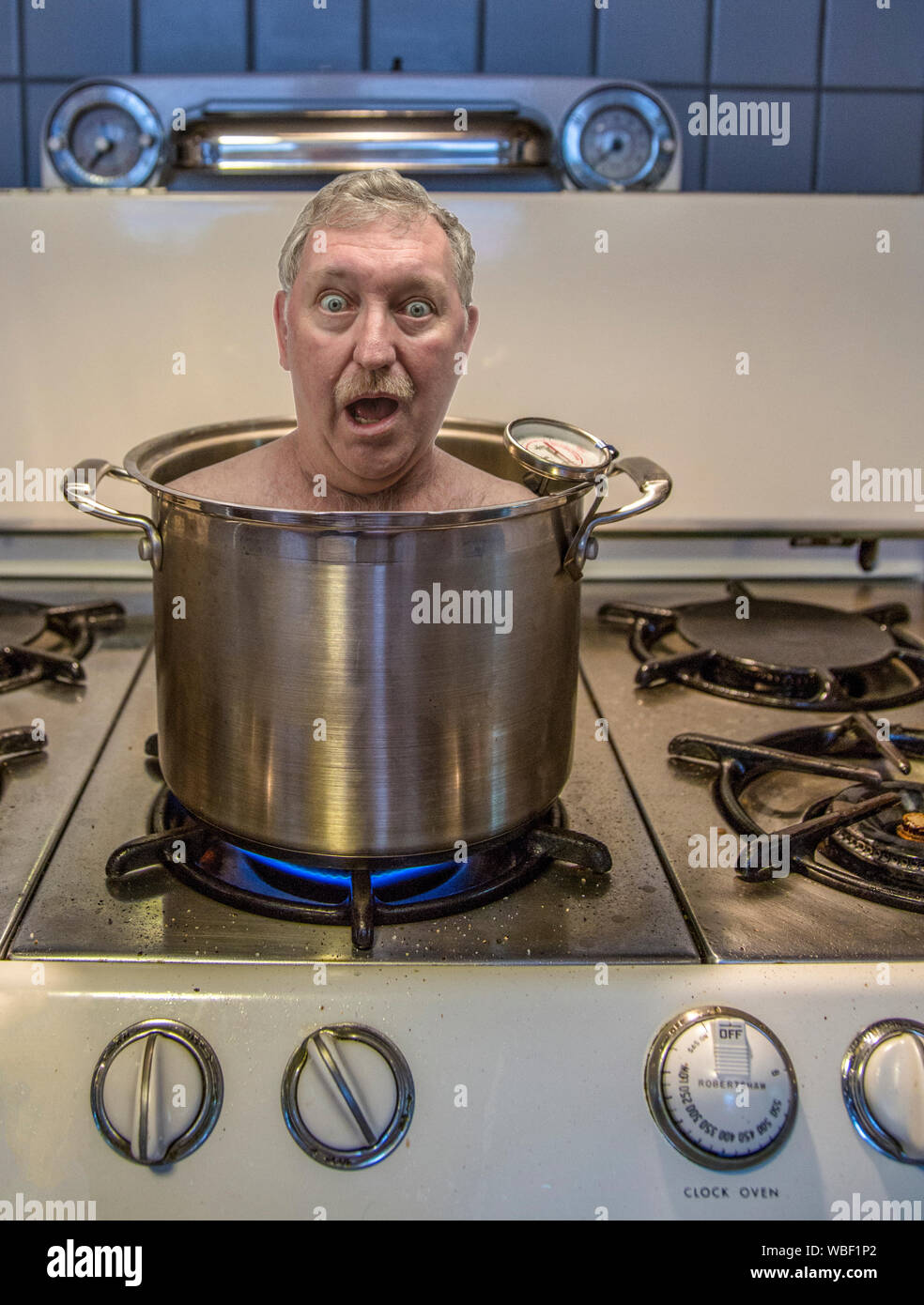 Man s head shown in pot of boiling water on stove. Studio image. Apr 23 ...