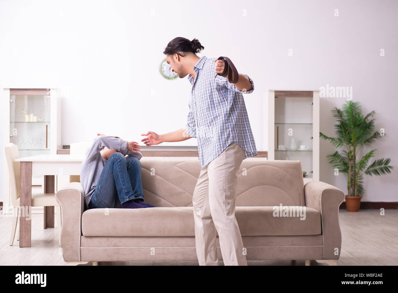 The father beating and punishing his sone Stock Photo - Alamy
